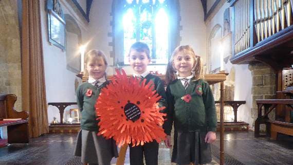 Rogate pupils lay 'poppy' wreath at remembrance service ...
