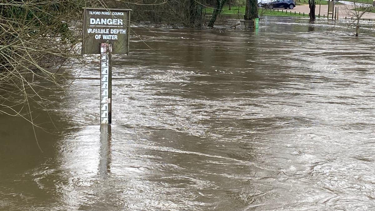 VIDEO: Tilford divided by a flooded River Wey, deep surface water on ...