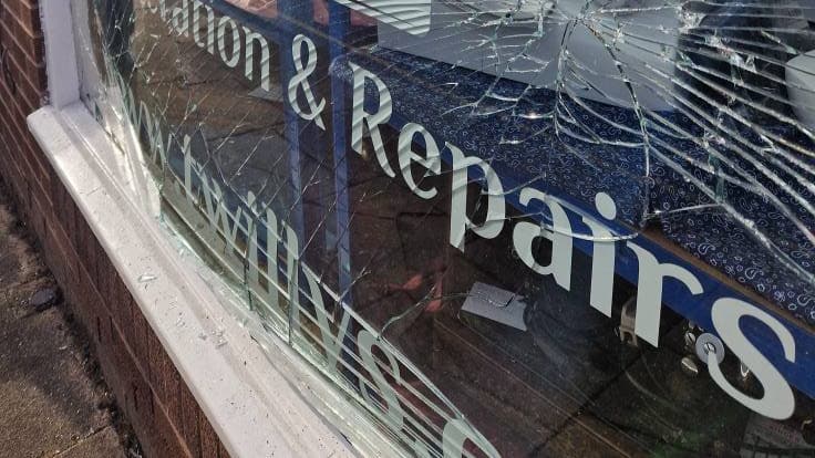 Tyre blast shatters shop window on eve of first anniversary in ...